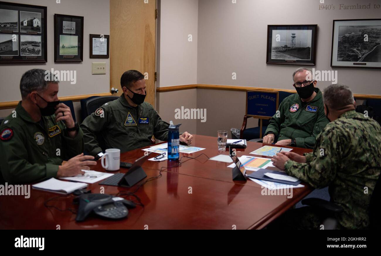 Adm. Bill Lescher, Vice Chief of Naval Operations, center, holds an ...