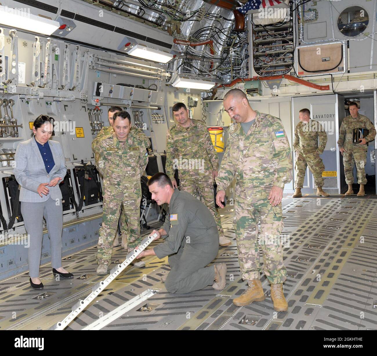 Senior Airman Christopher J. Mallette demonstrates the cargo roller ...