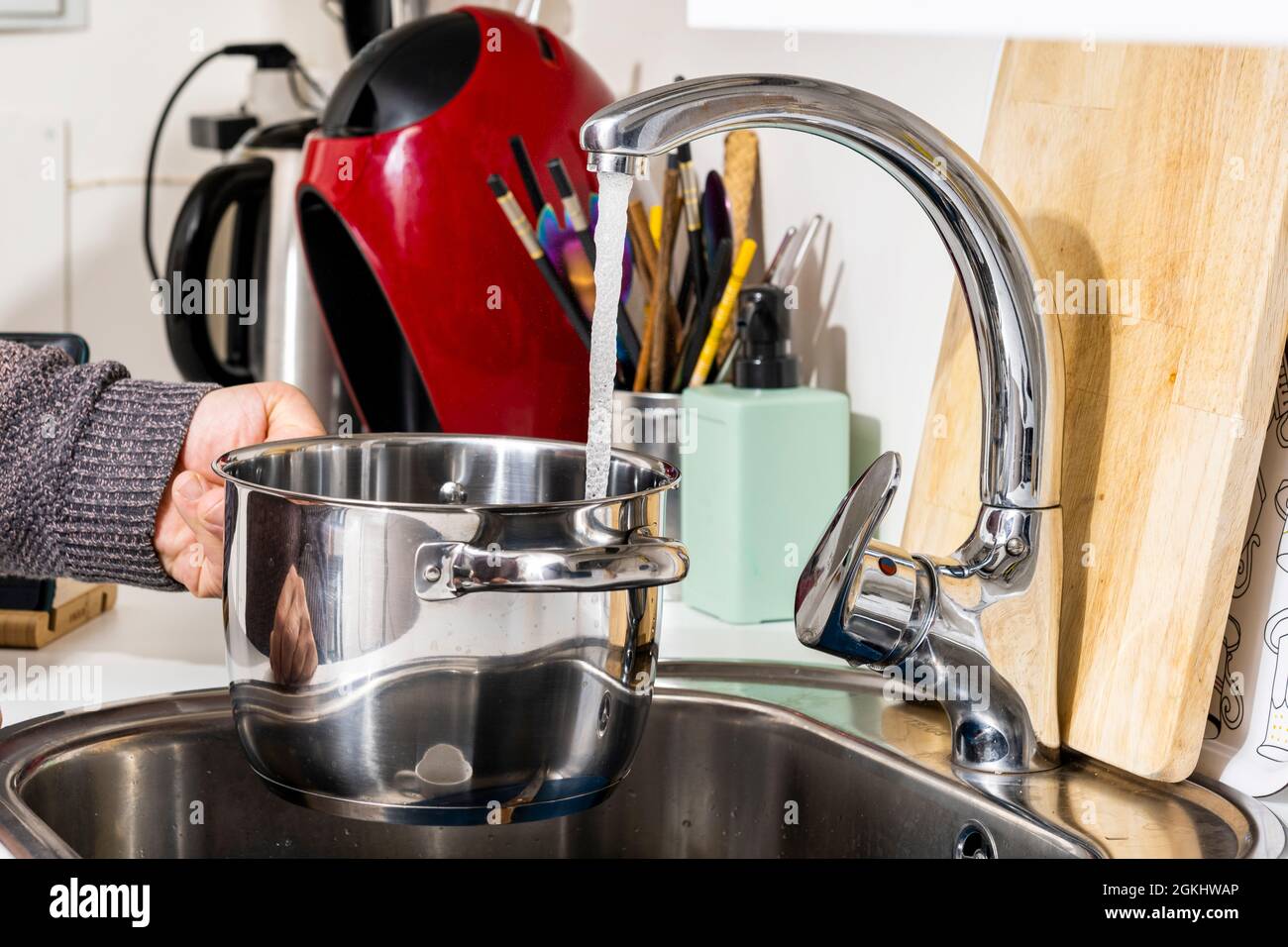 Filling water pot hi-res stock photography and images - Alamy