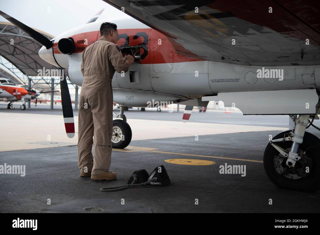 Pilot, conducts a pre flight inspection hi-res stock photography and ...