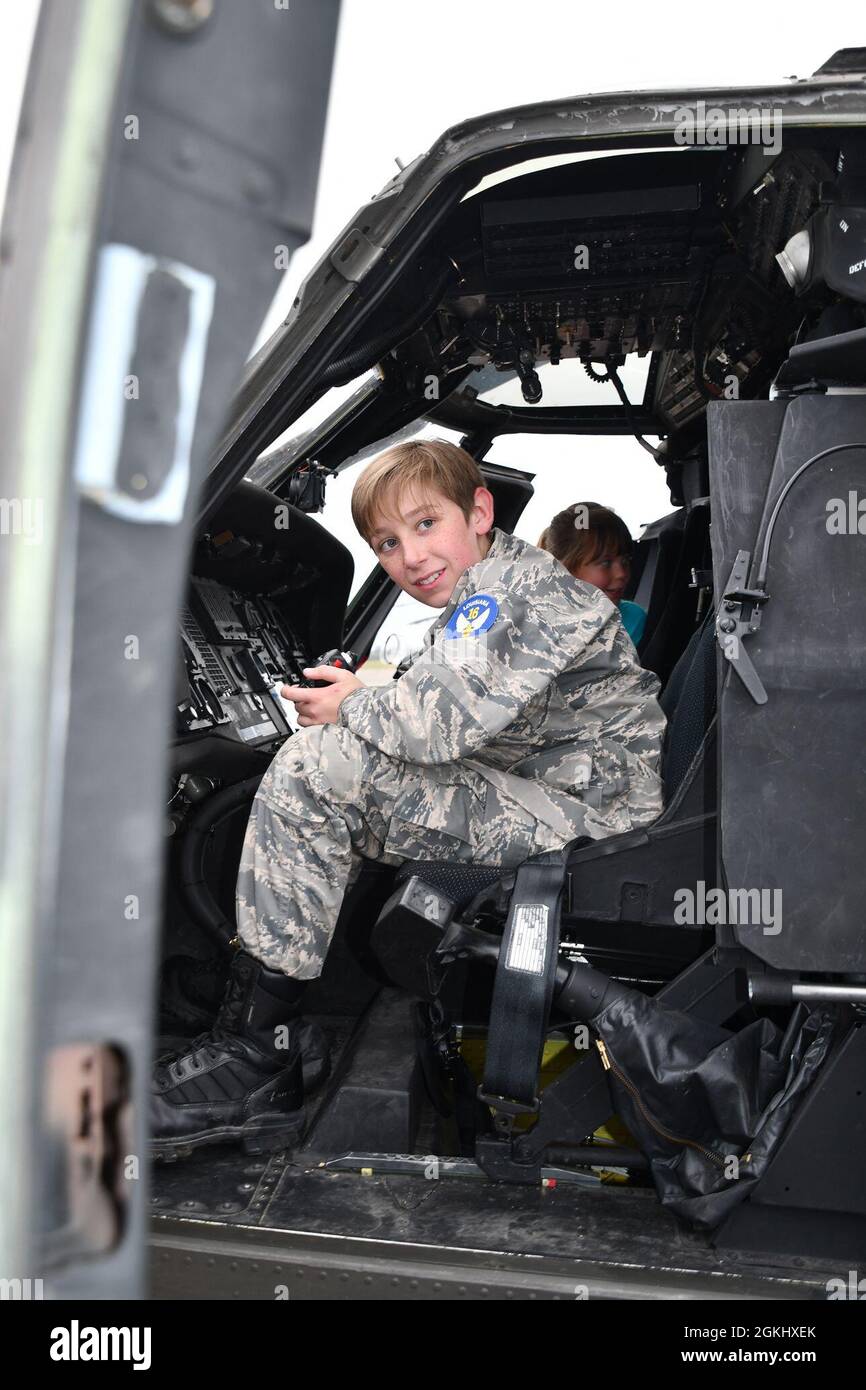 Cadet Airman Wesley Walker, 12, gets a feel for the controls in the ...