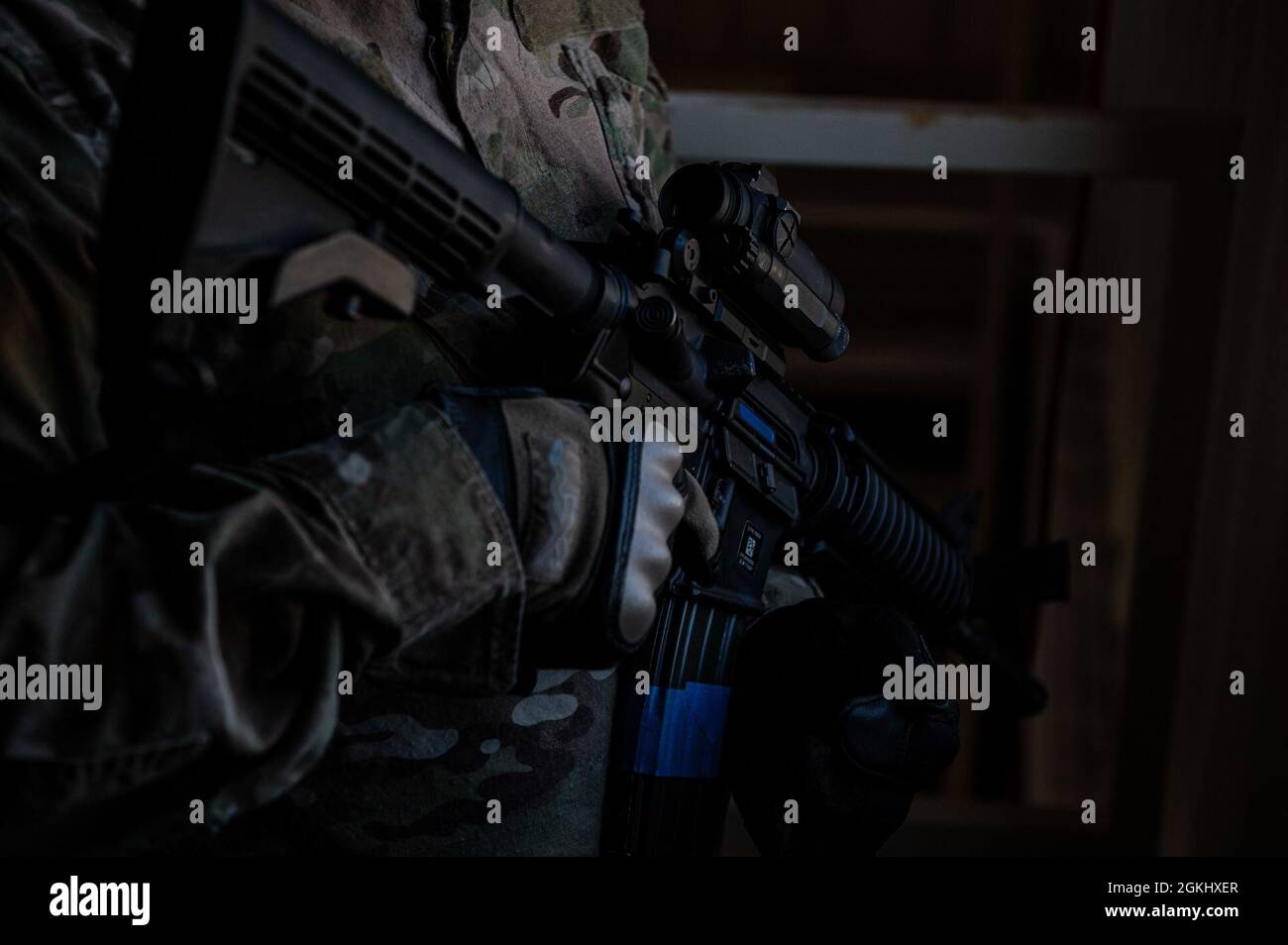 A member of the 20th Security Forces Squadron (SFS) holds her weapon ...