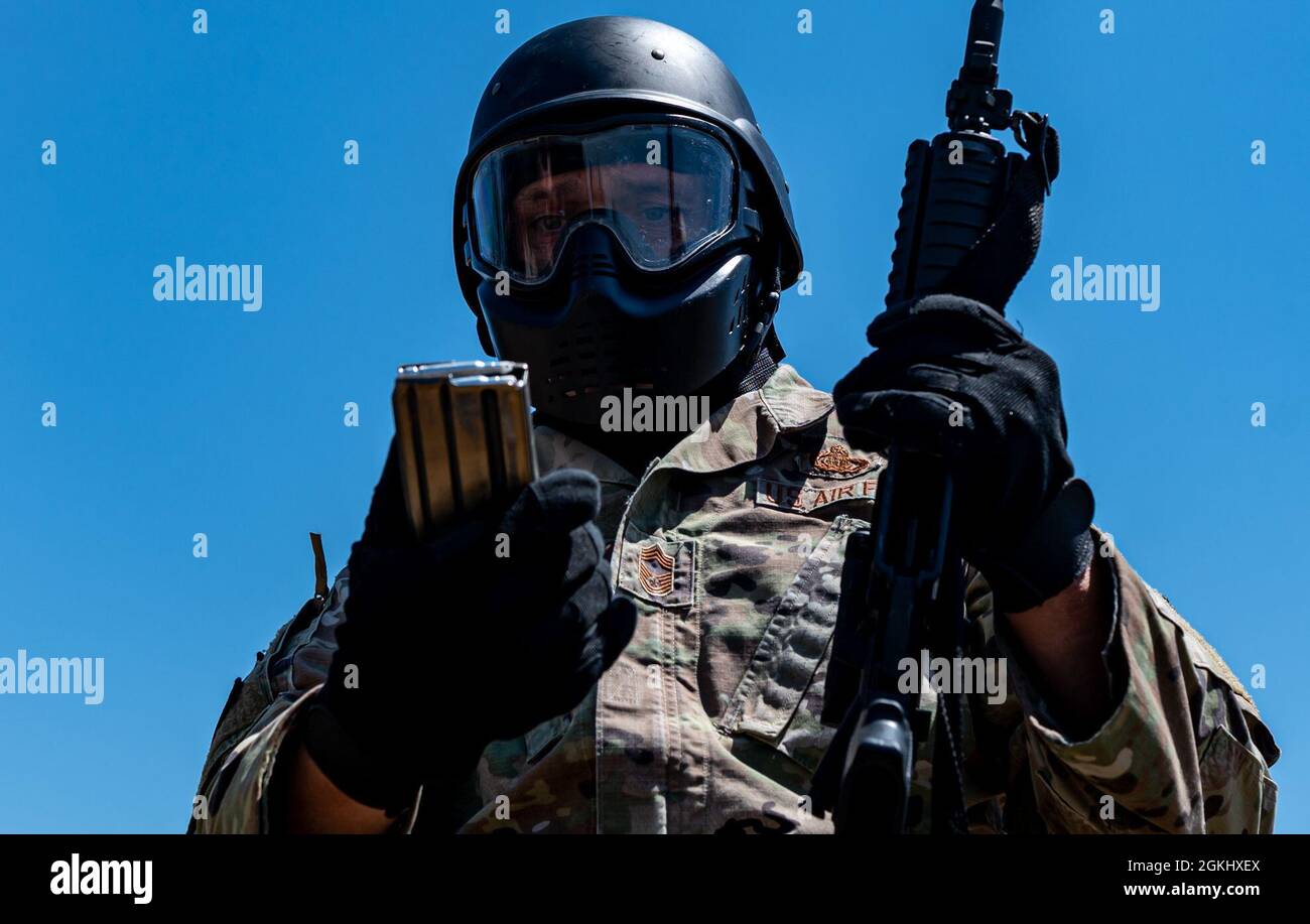 A member of Shaw Air Force Base’s command team checks his weapon during ...