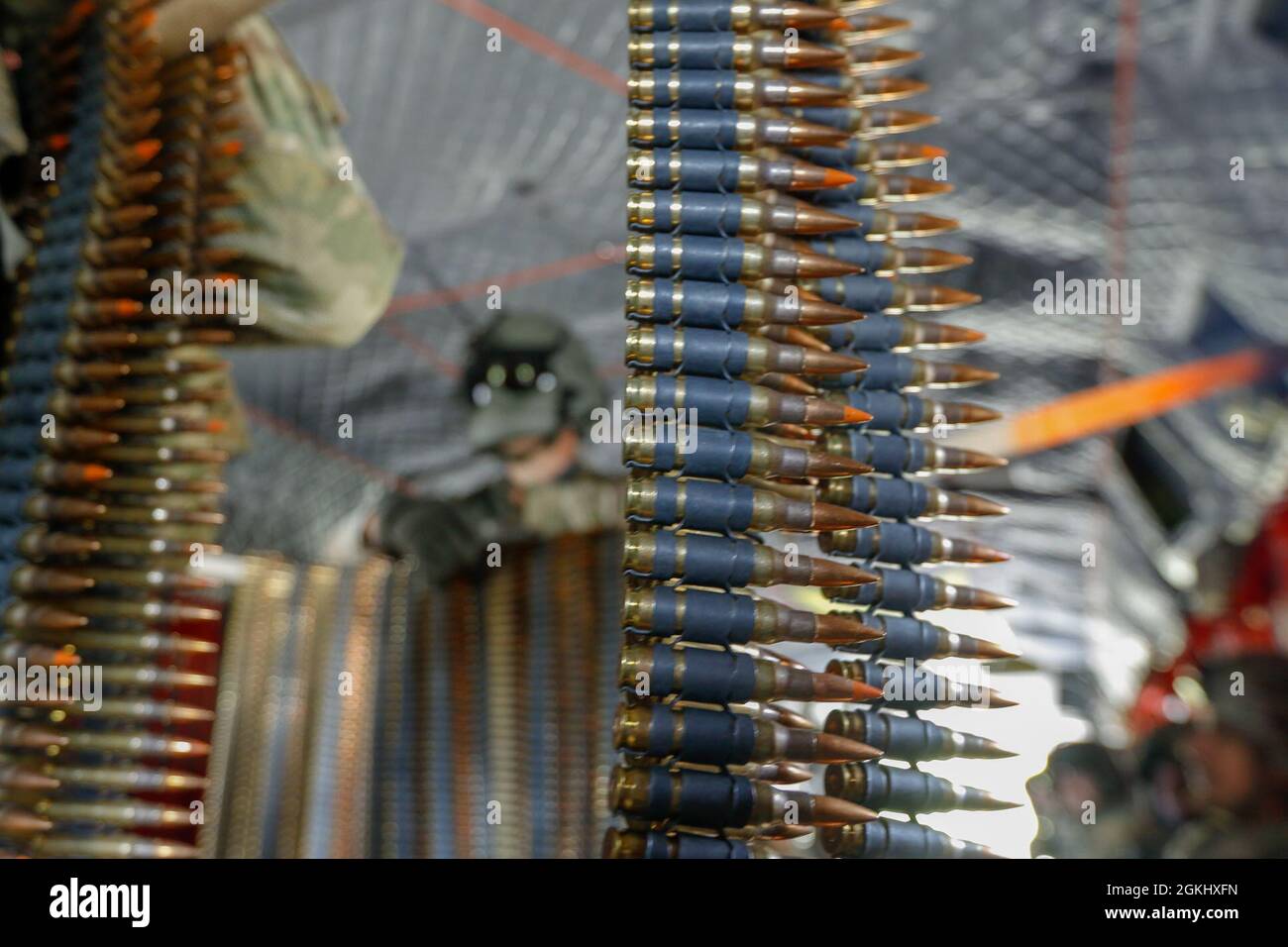 Belts of 7.62 mm ammunition sit ready to be loaded and fired from a CH ...