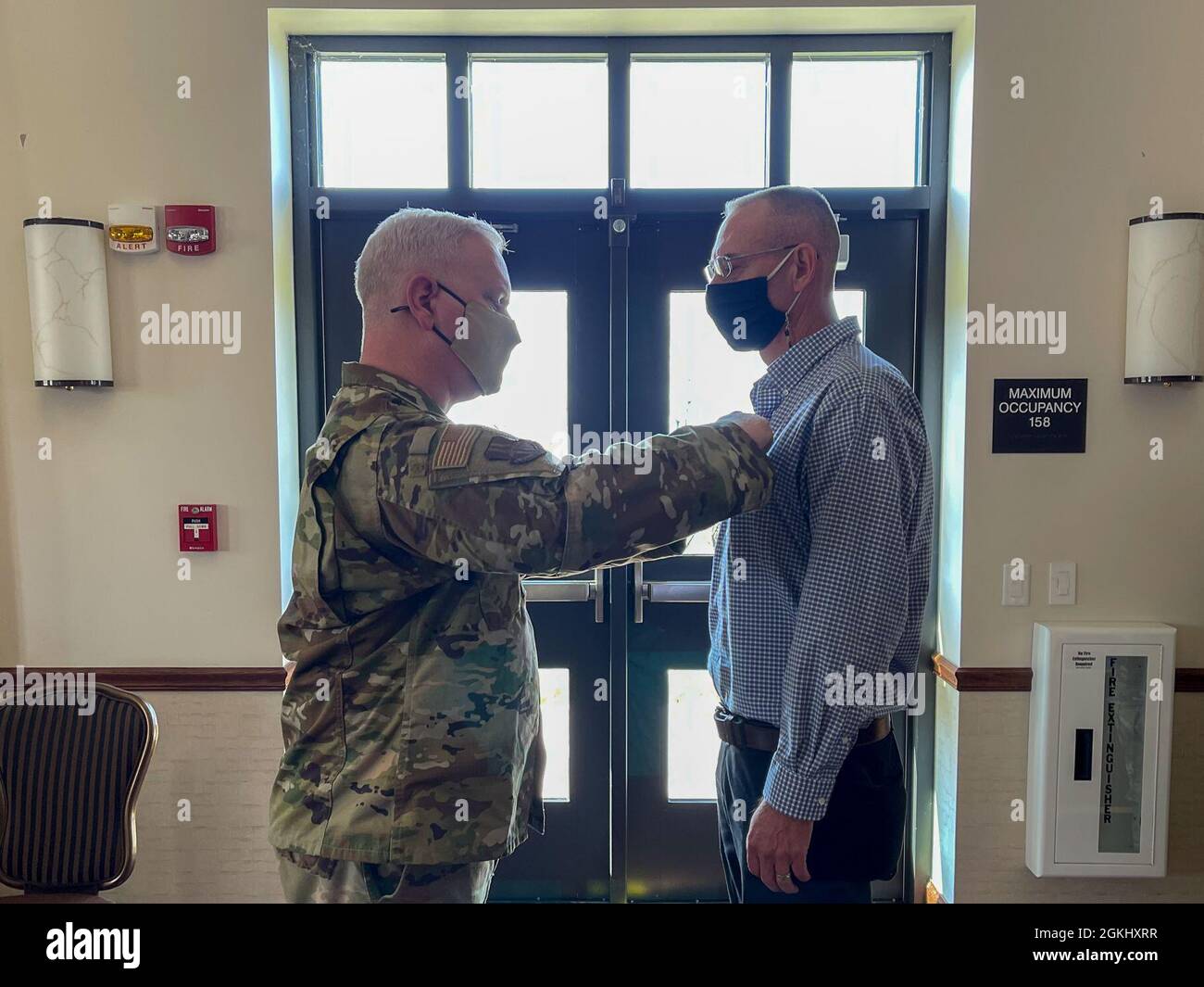 Col. Carl Magnusson, 914th Air Refueling Wing commander, pins the Air ...