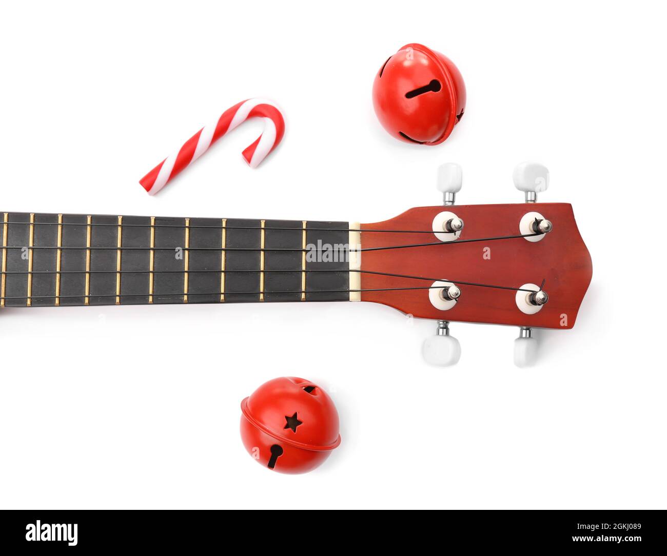 Guitar, bells and candy cane on white background. Christmas music ...