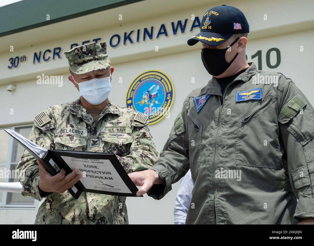 CAMP SHIELDS, Japan (Apr. 28, 2021) Capt. Scott Hardy, right, Commander ...