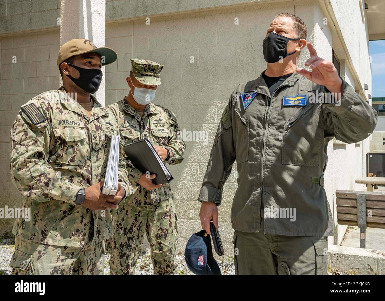 CAMP SHIELDS, Japan (Apr. 28, 2021) Capt. Scott Hardy, right, Commander ...