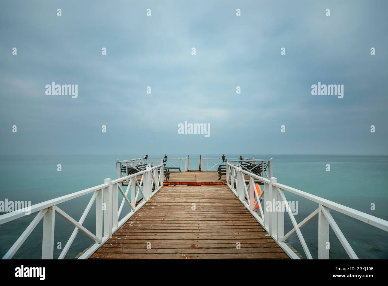 Pier with wooden plank flooring and hammocks to liven up the wait while ...