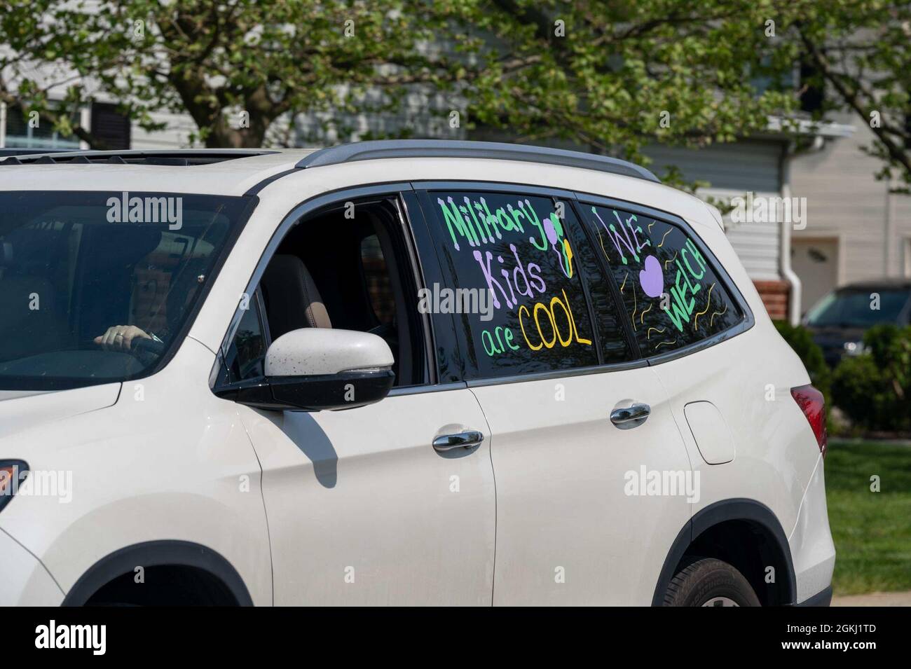 A faculty member from George S. Welch Elementary School drives her ...
