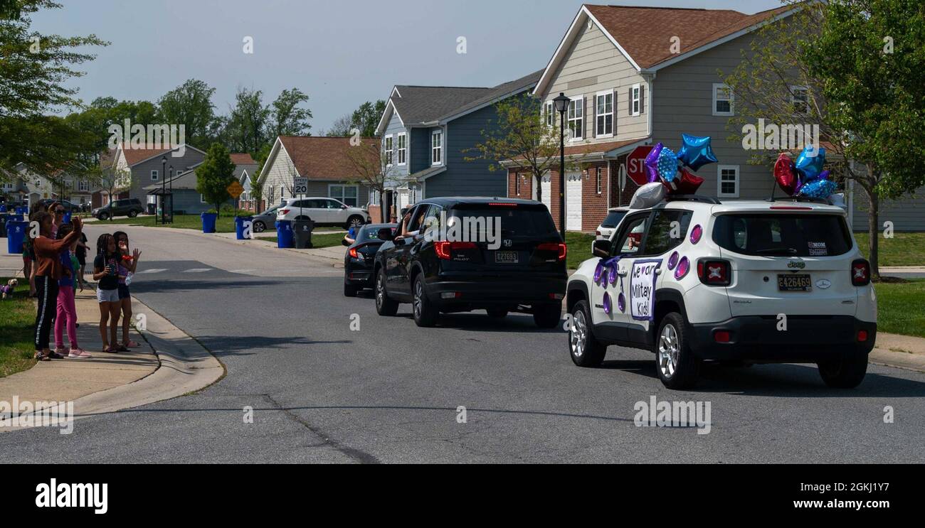 Children wave as teachers and faculty from George S. Welch Elementary ...