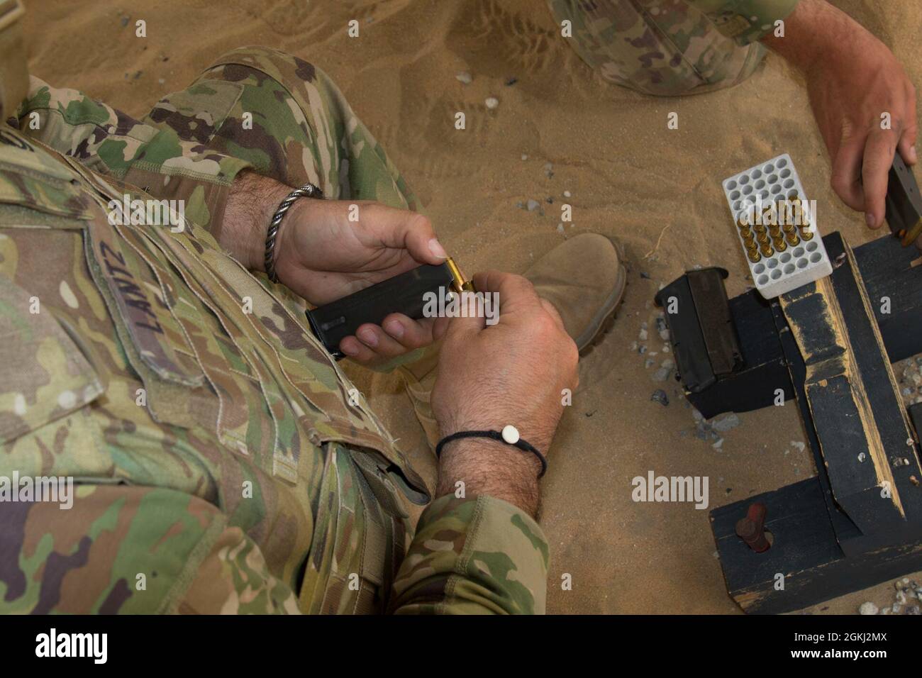 U.S. Army Sgt. 1st Class Lantz, 111th Theater Engineer Brigade, loads a ...