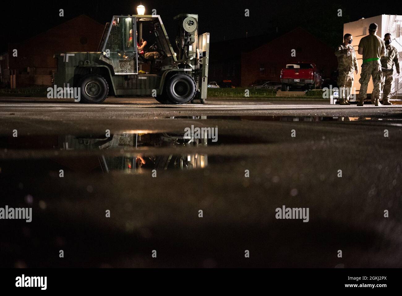 Airmen from the 375th Logistics Readiness Squadron load cargo during a ...