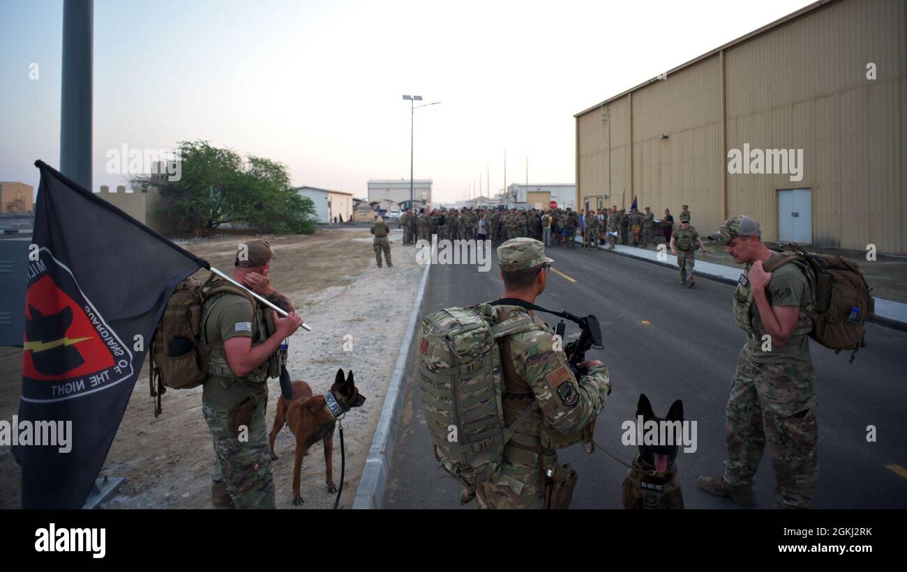 U.S. military troops participate in a ruck march for National Police ...