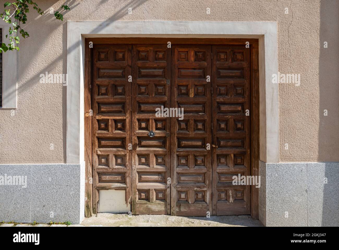 Square vintage door with wooden panels in a private home in Toledo ...