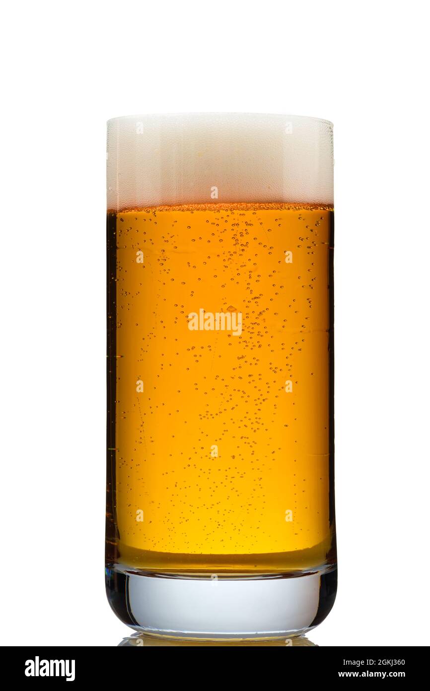 Closeup shot of a fresh beer with foam in a translucent glass isolated ...