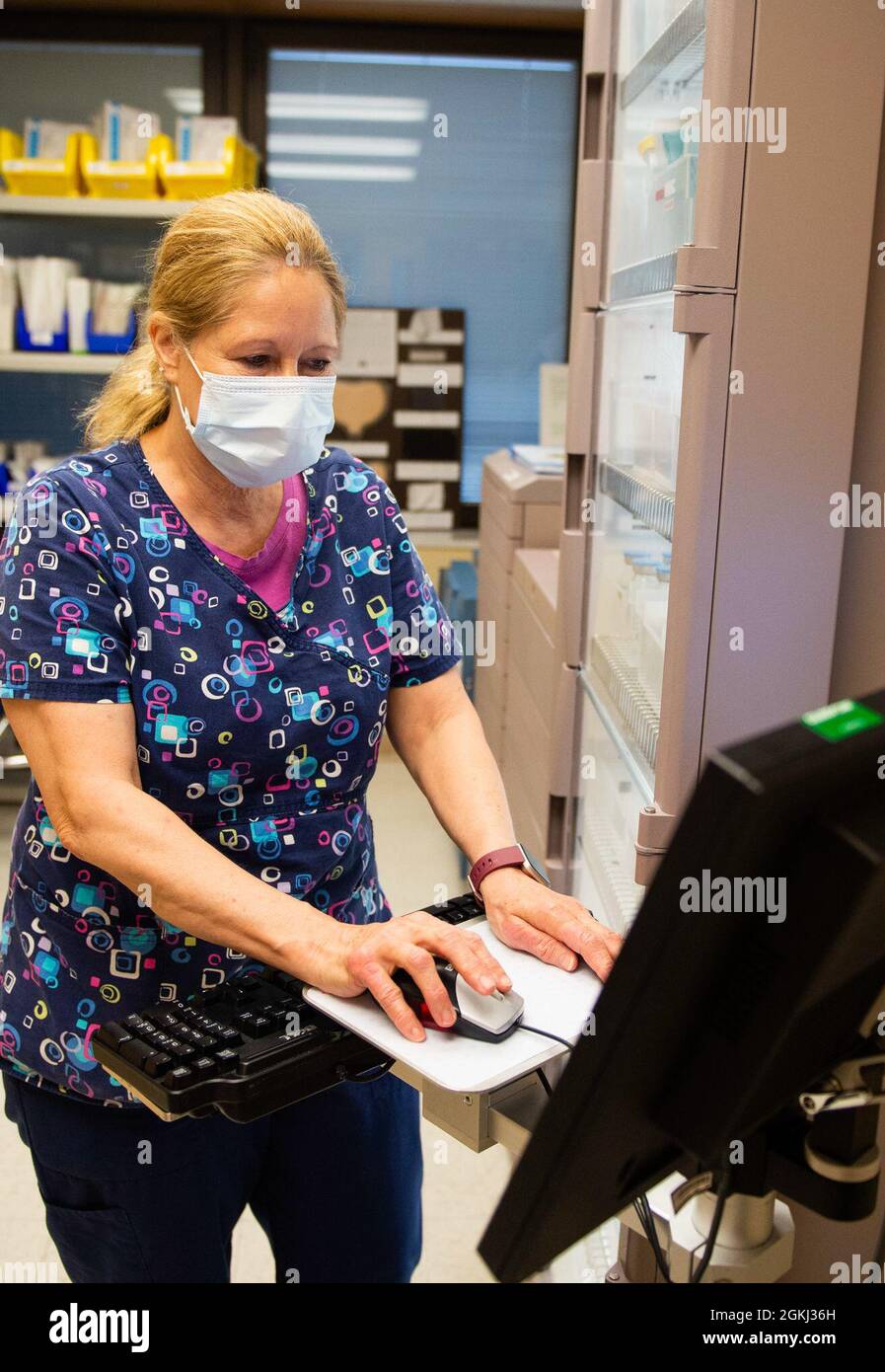 Brenda Fox, a registered nurse with the 88th Medical Group, retrieves ...
