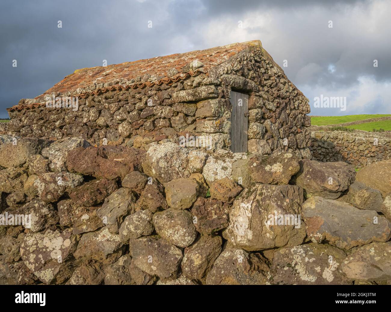 Ancient-looking stone building and fences on a farm on Terceira, Azores ...