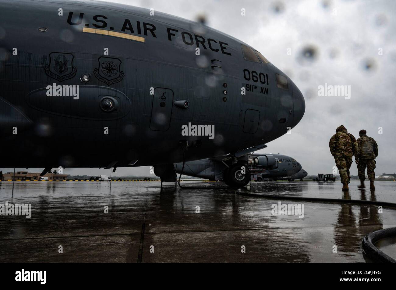 Airmen assigned to the 911th Aircraft Maintenance Squadron walk back to ...