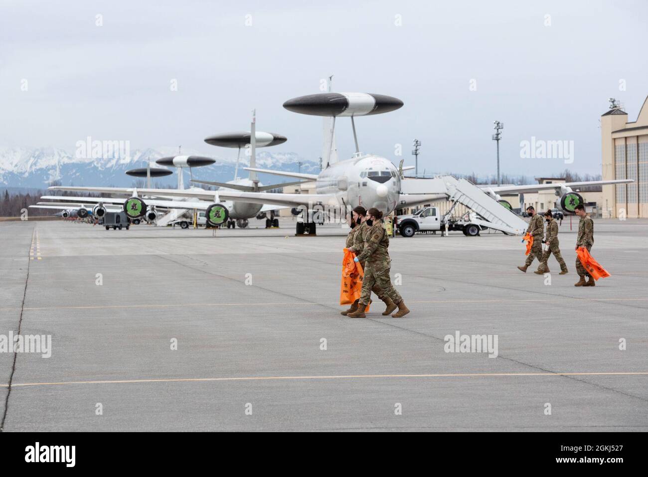 Airmen assigned to the 3rd Wing conduct a foreign object debris walk on ...