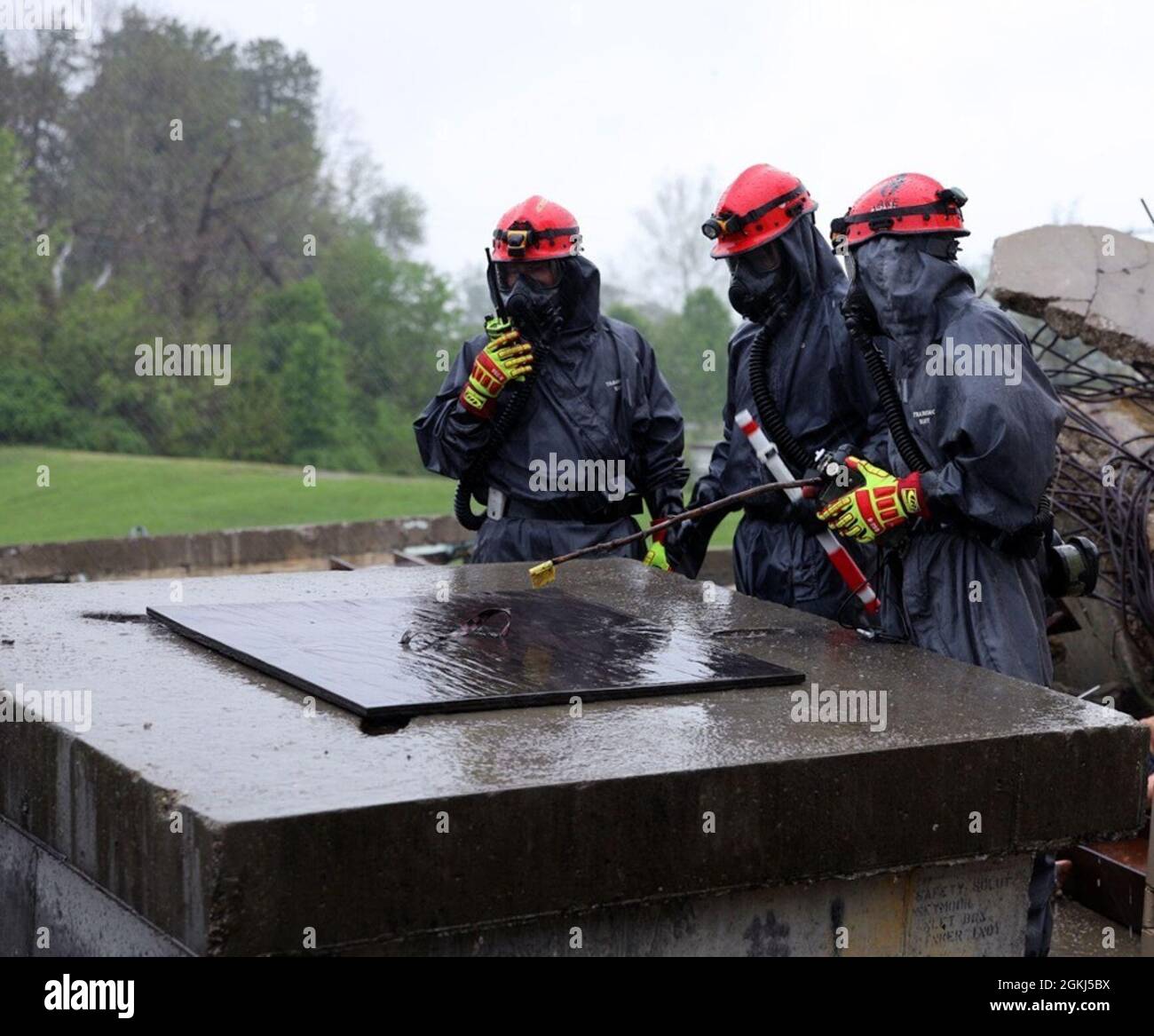 Staff Sgt. Bryan Becker (left) radios for a casualty rescue team while ...