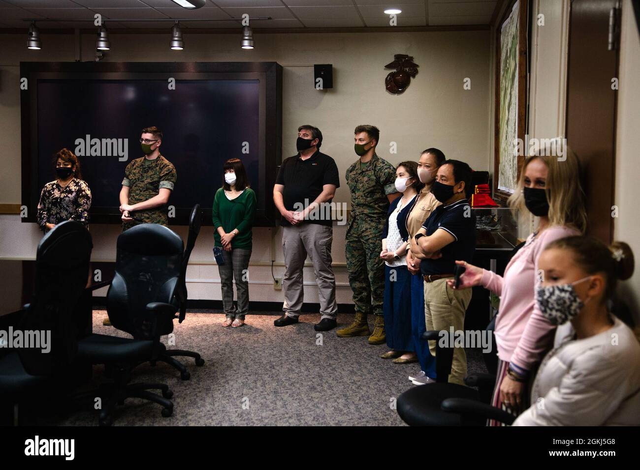 U.S. Marines, civilians, and master labor contractors listen to opening ...