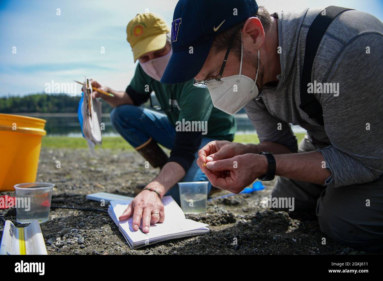 Jake Gregg, left, a fish biologist for United States Geological Survey ...