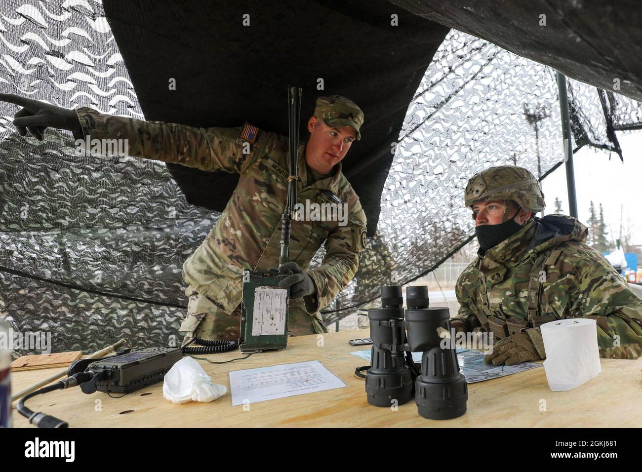 A grader gives instructions to a paratrooper assigned to 4th Infantry ...