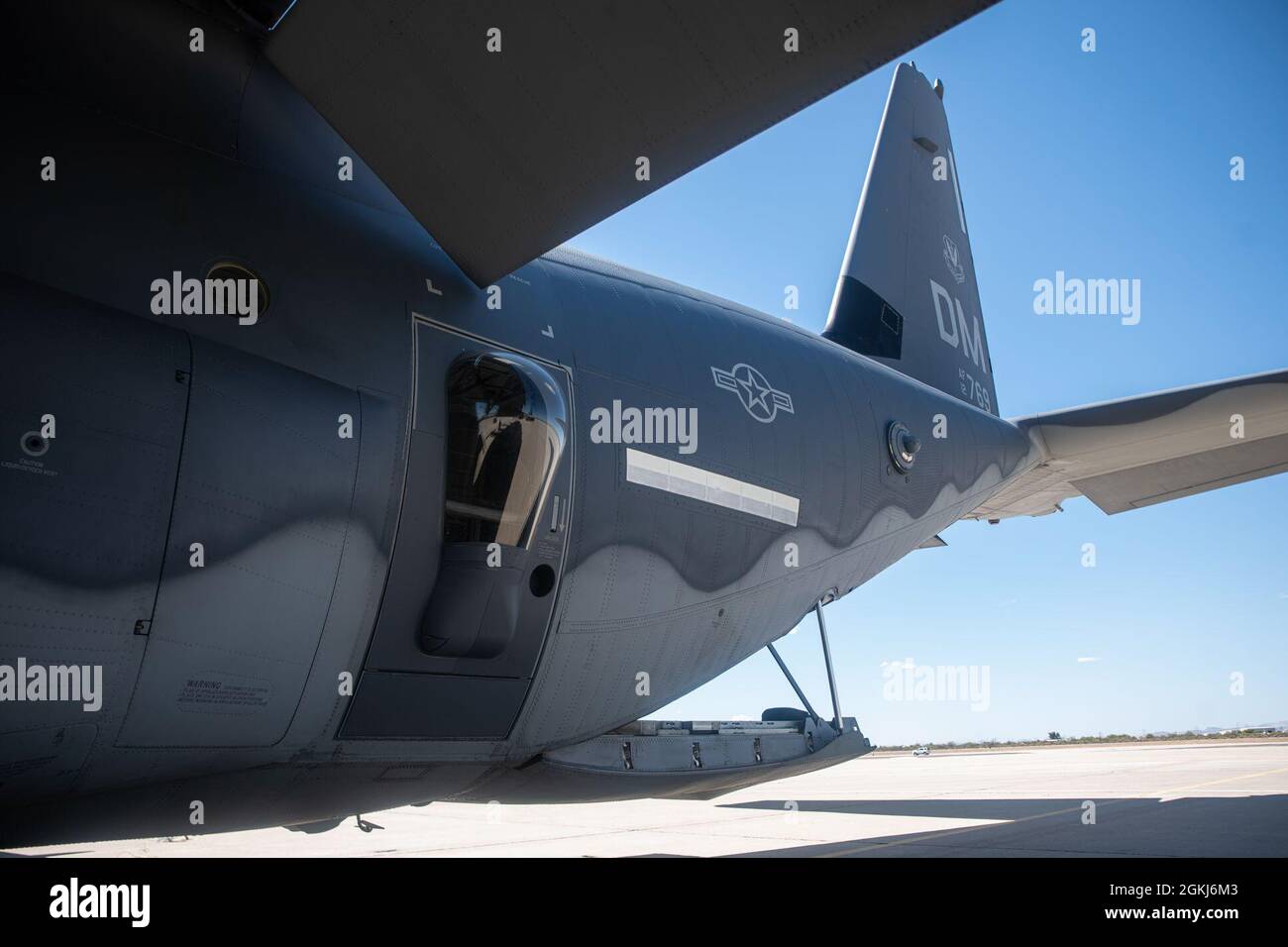 A U.S. Air Force HC-130J Combat King II sits on the flight line at ...