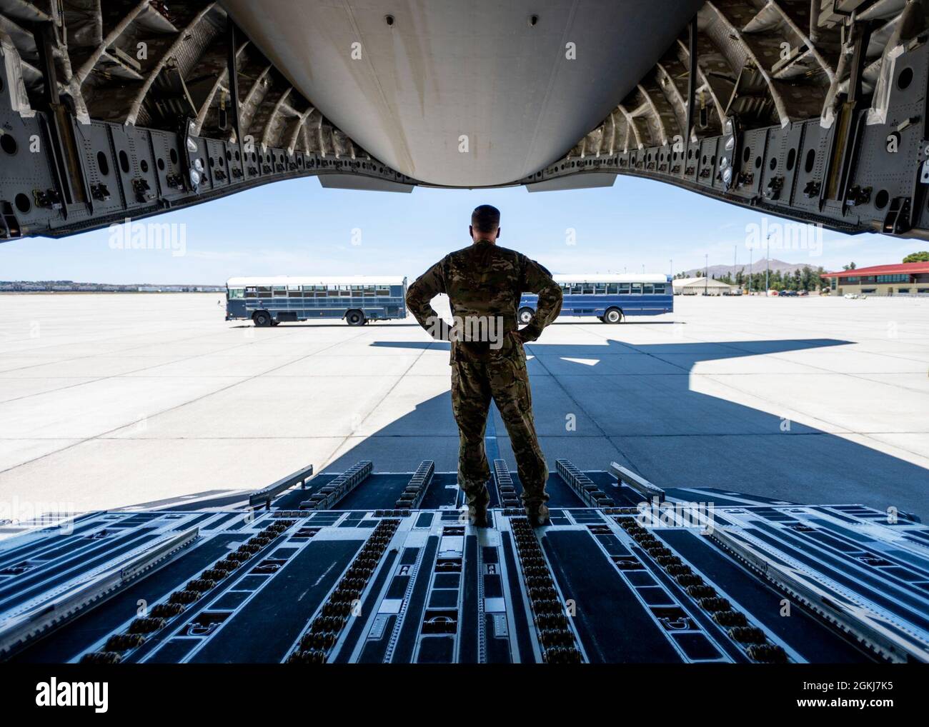 A C-17 Globemaster III loadmaster awaits passengers and cargo on the ...