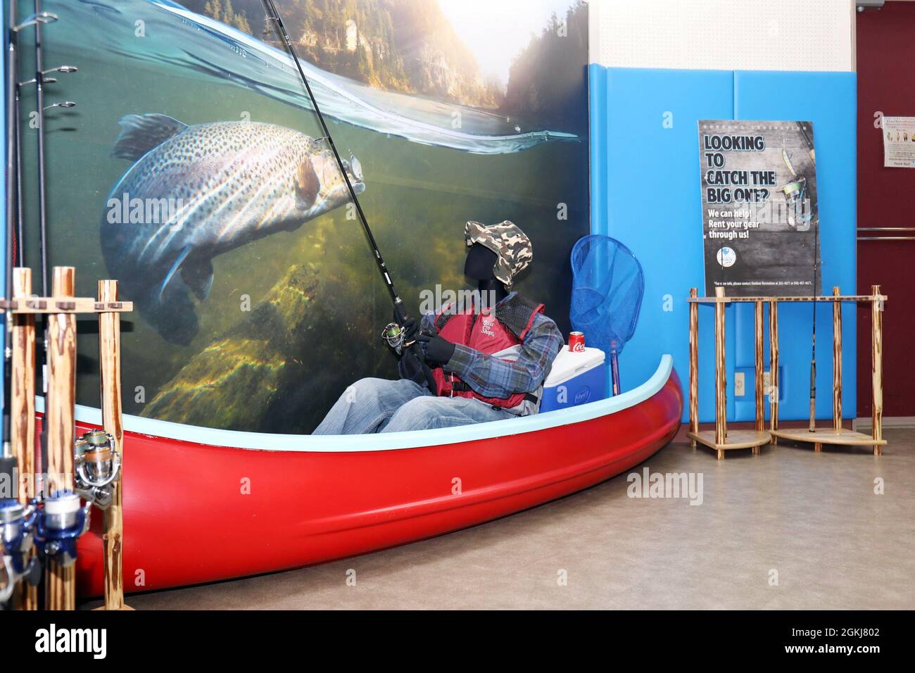 A life-sized fishing display stands inside the new Outdoor Recreation ...
