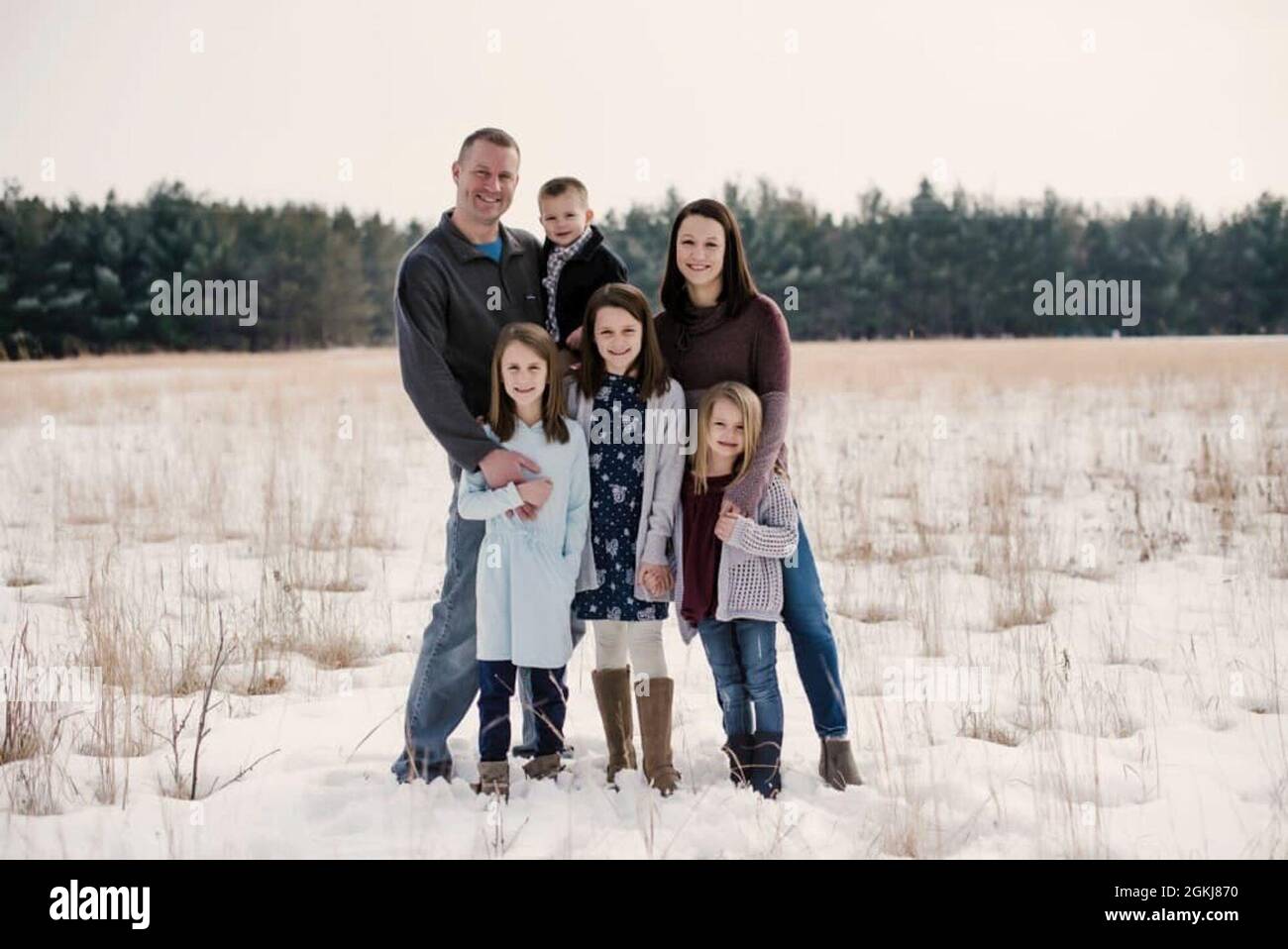 Angela and Andy Ebert pose with their four children, Abigail, 9 ...