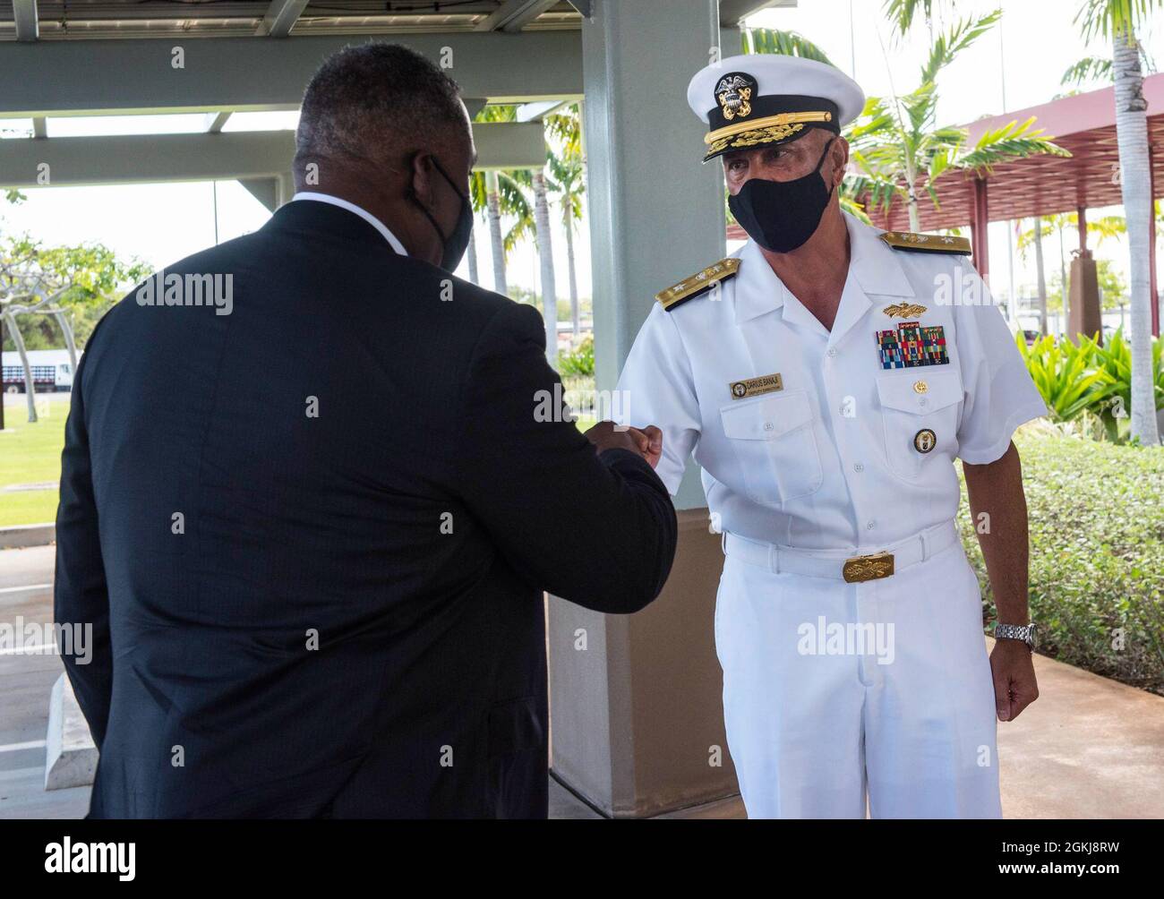 From left, Secretary of Defense Lloyd J. Austin III is greeted by U.S ...