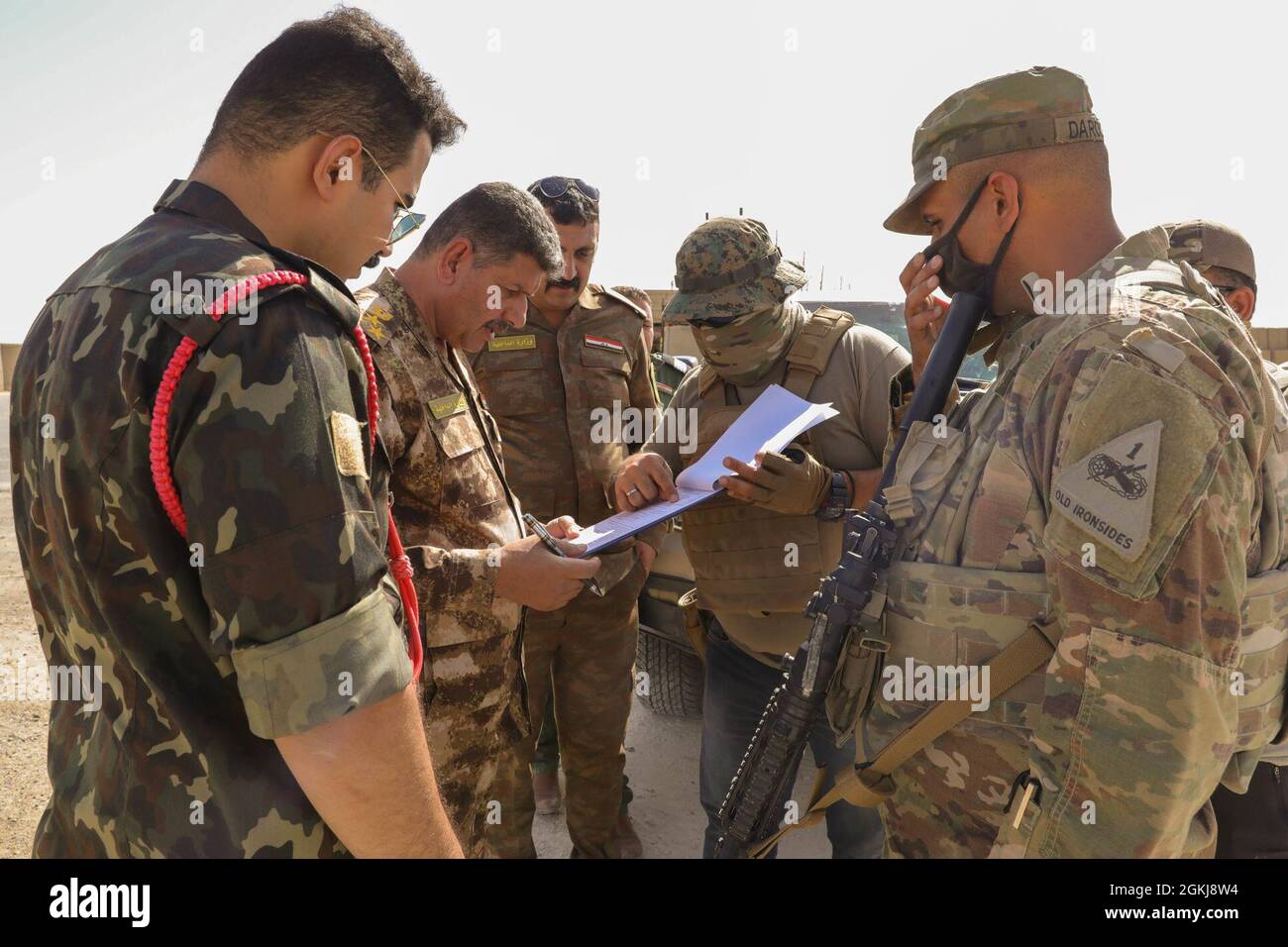 Iraqi Brigadier General reviewed the inventory with American Soldier ...