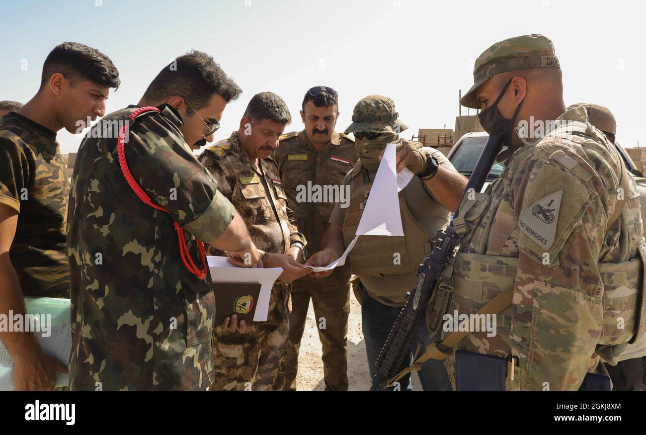 Iraqi Brigadier General reviewed the inventory with American Soldier ...