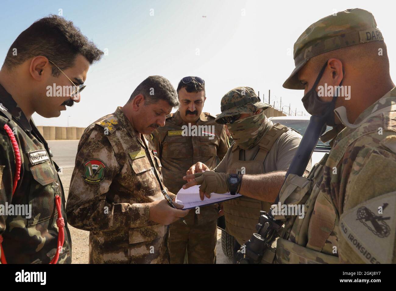 Iraqi Brigadier General reviewed the inventory with American Soldier ...
