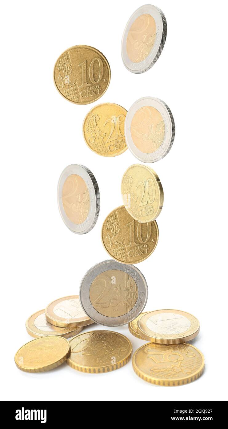 Falling golden coins on white background Stock Photo - Alamy
