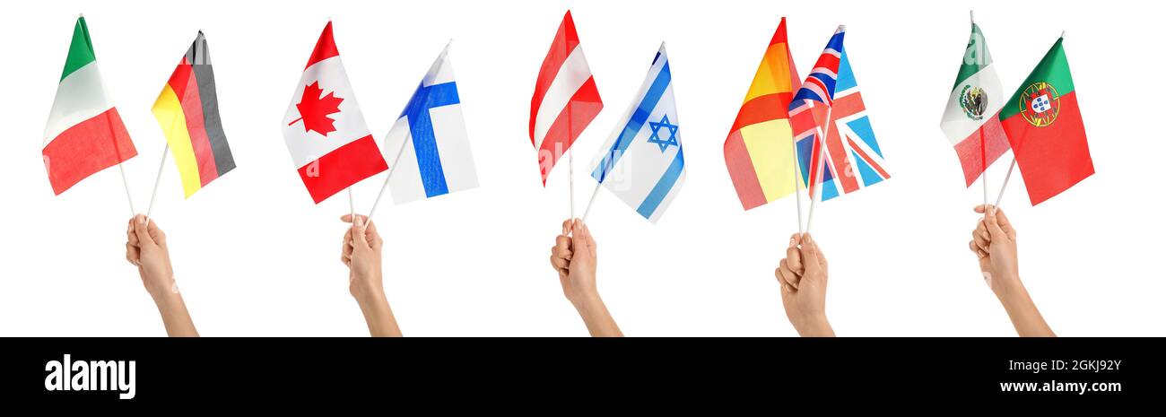 Female hands with flags of different countries on white background ...