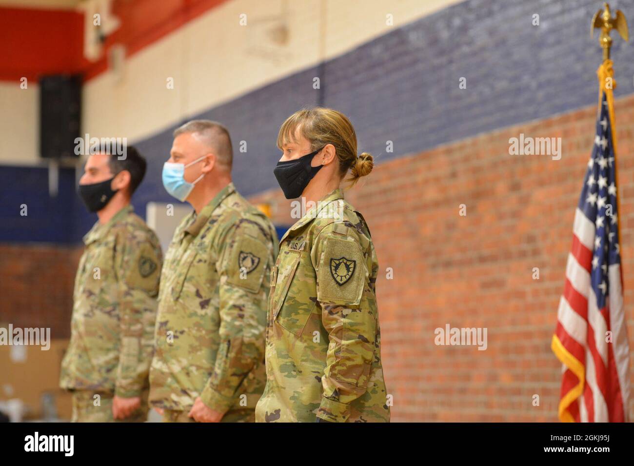 1st Lt. Ellen Morrison stands for the Army Song, alongside Lt. Col ...