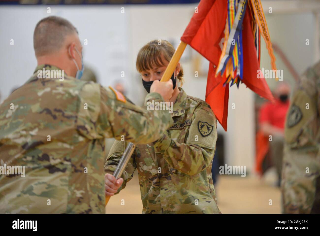 1st Lt. Ellen Morrison accepts the guidon of the 251st Engineer Company ...