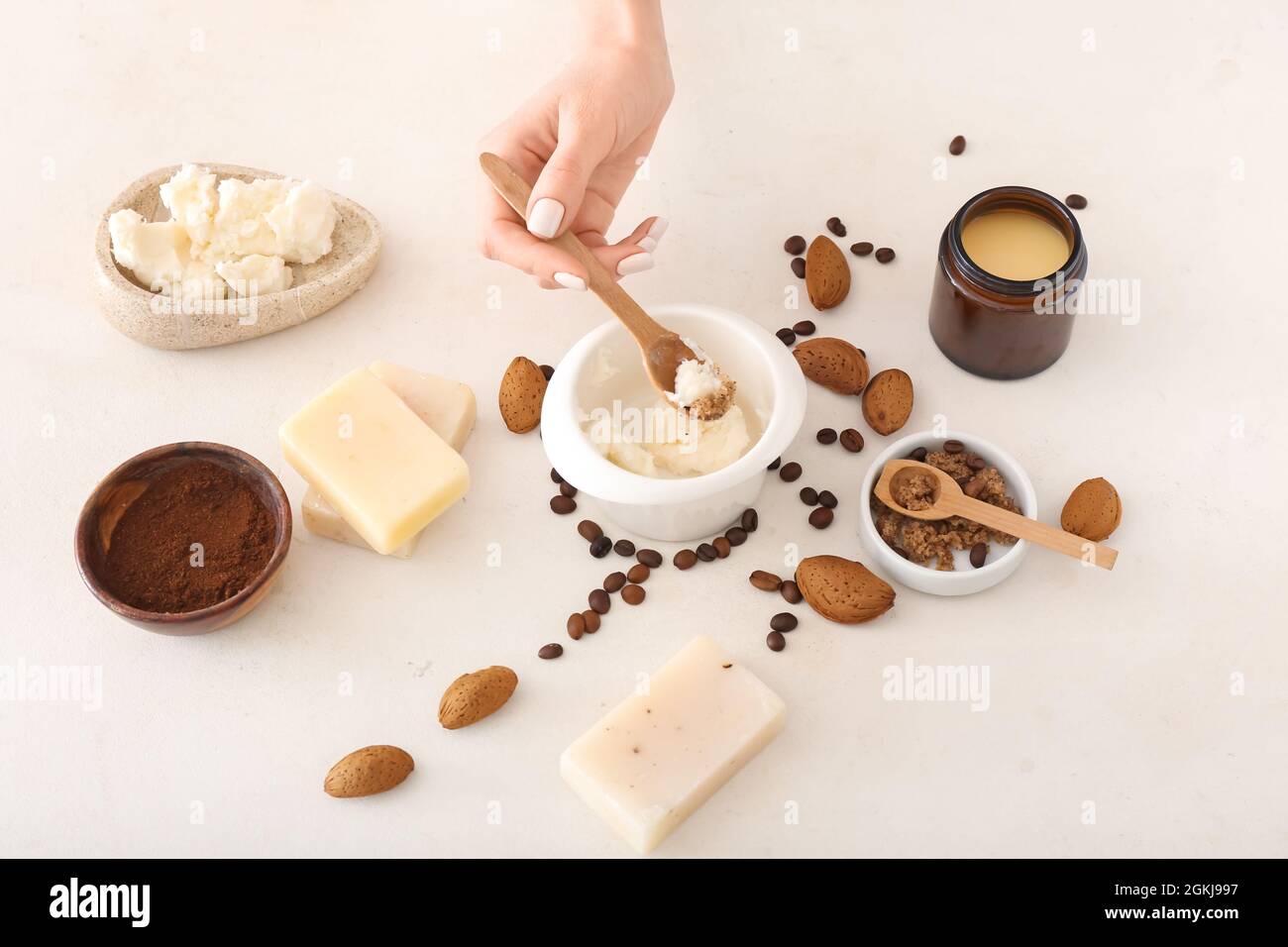 Woman making natural soap on white background Stock Photo - Alamy