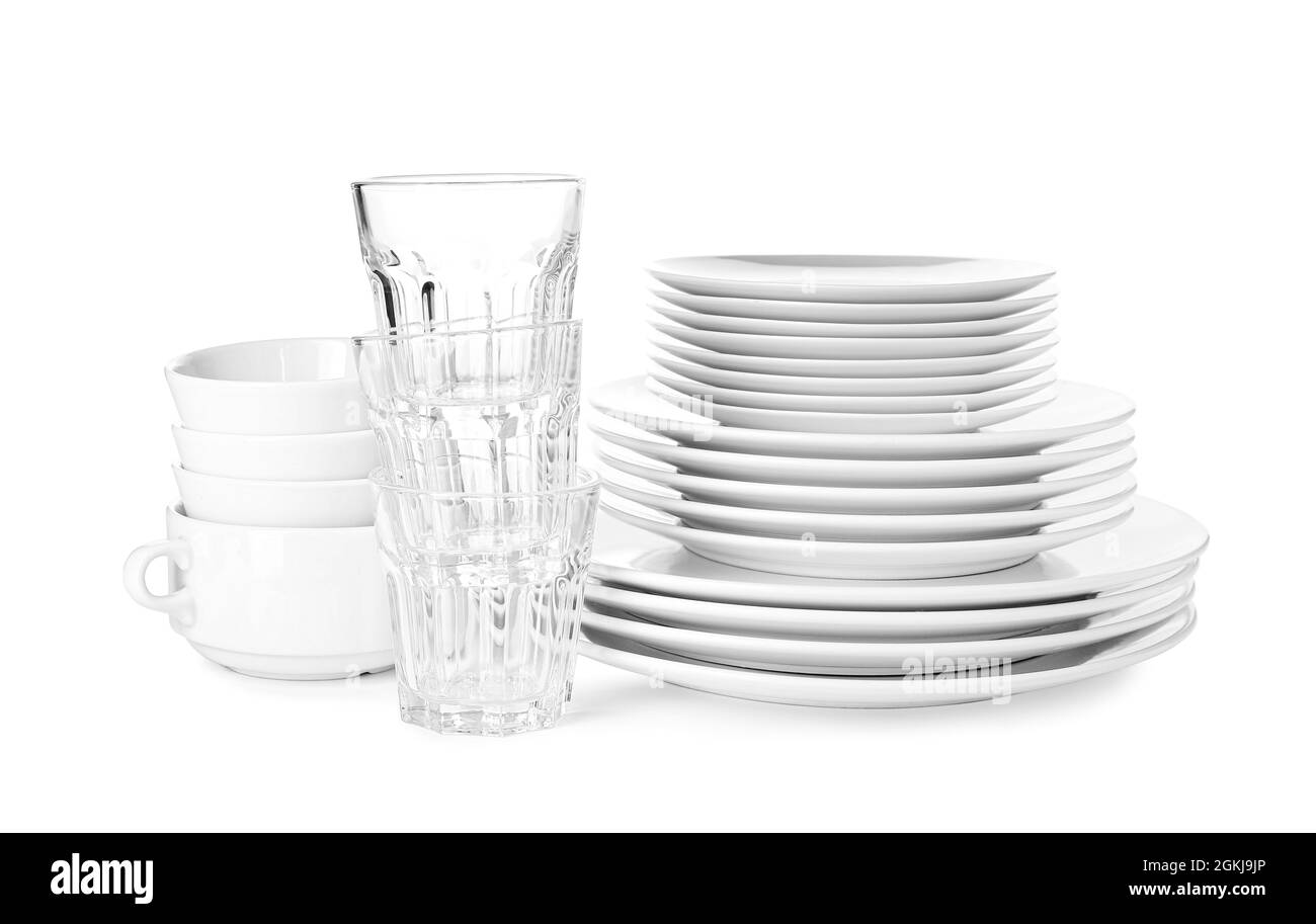 Different clean dishes on white background Stock Photo - Alamy