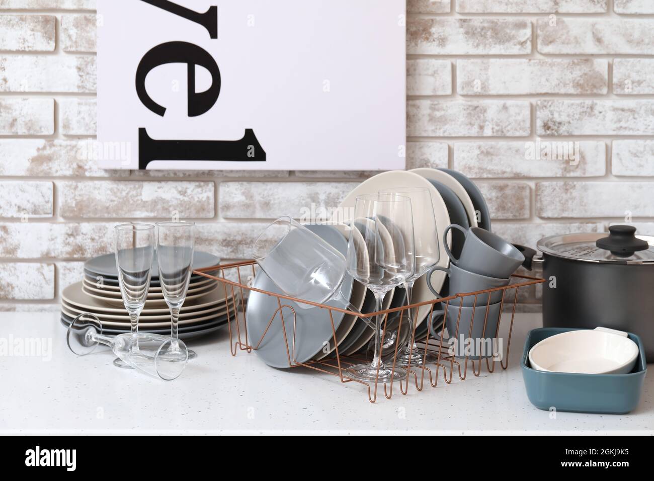 Set of clean dishes on counter in kitchen Stock Photo - Alamy
