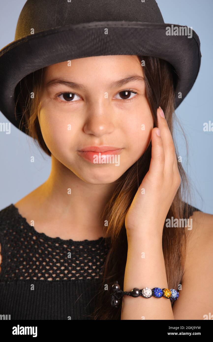 Close-up portrait of a bright cute dark-haired teenage girl 12 years ...