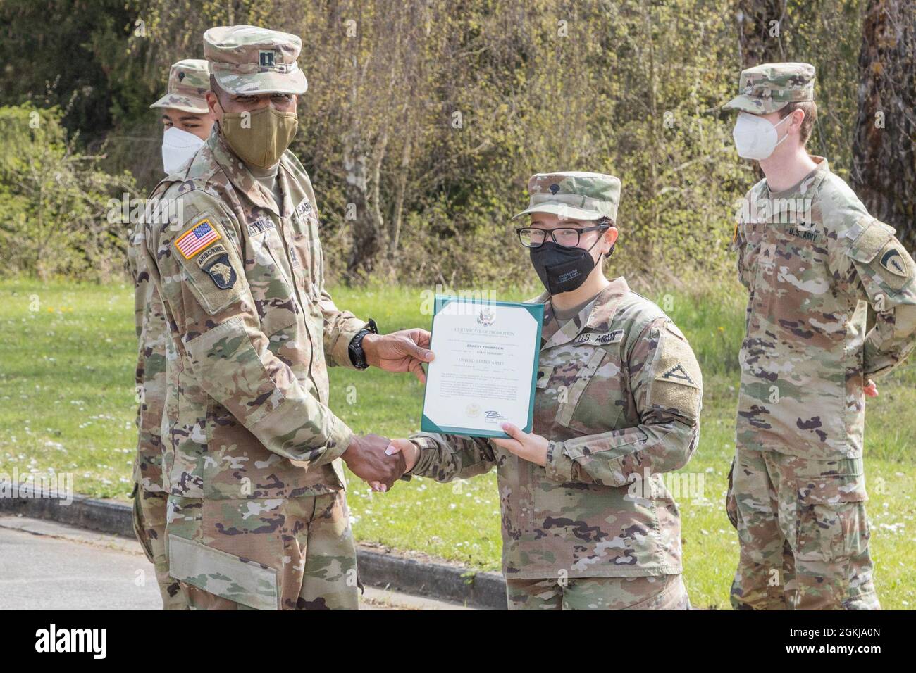 U.S. Army Capt. Andrew Matwijec presents Spc. Alexis Pacheco assigned ...