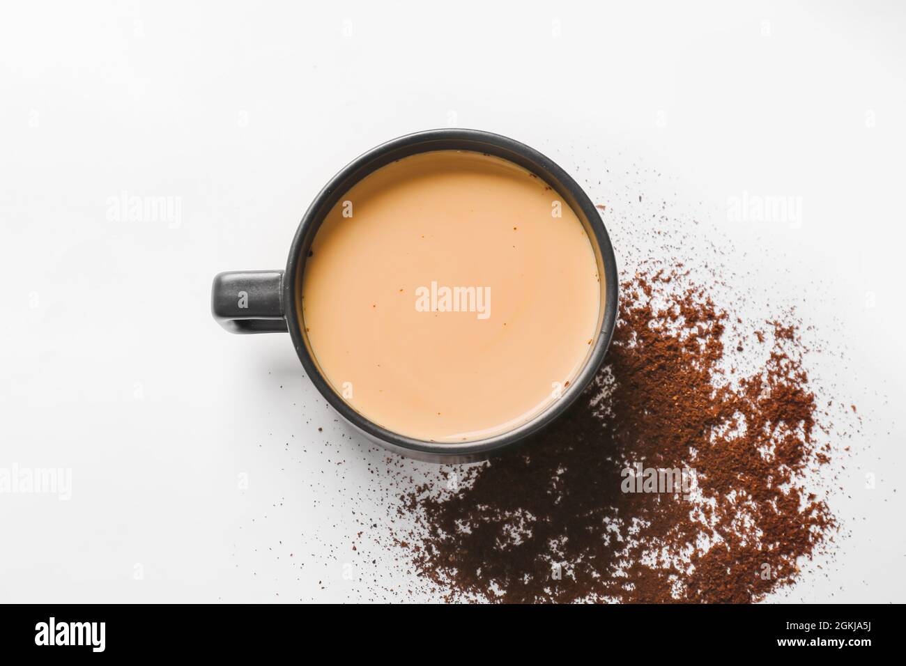 Cup of coffee and powder on light background Stock Photo - Alamy