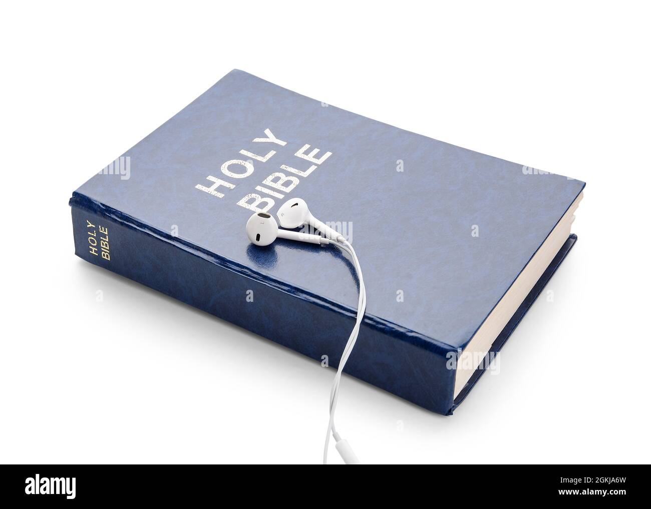 Holy Bible and earphones on white background Stock Photo - Alamy