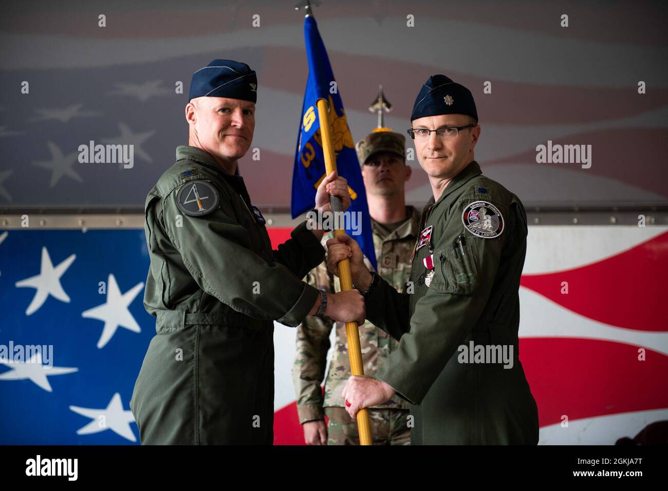 Lt. Col. Jonathan Bott, right, outgoing 333rd Fighter Squadron ...