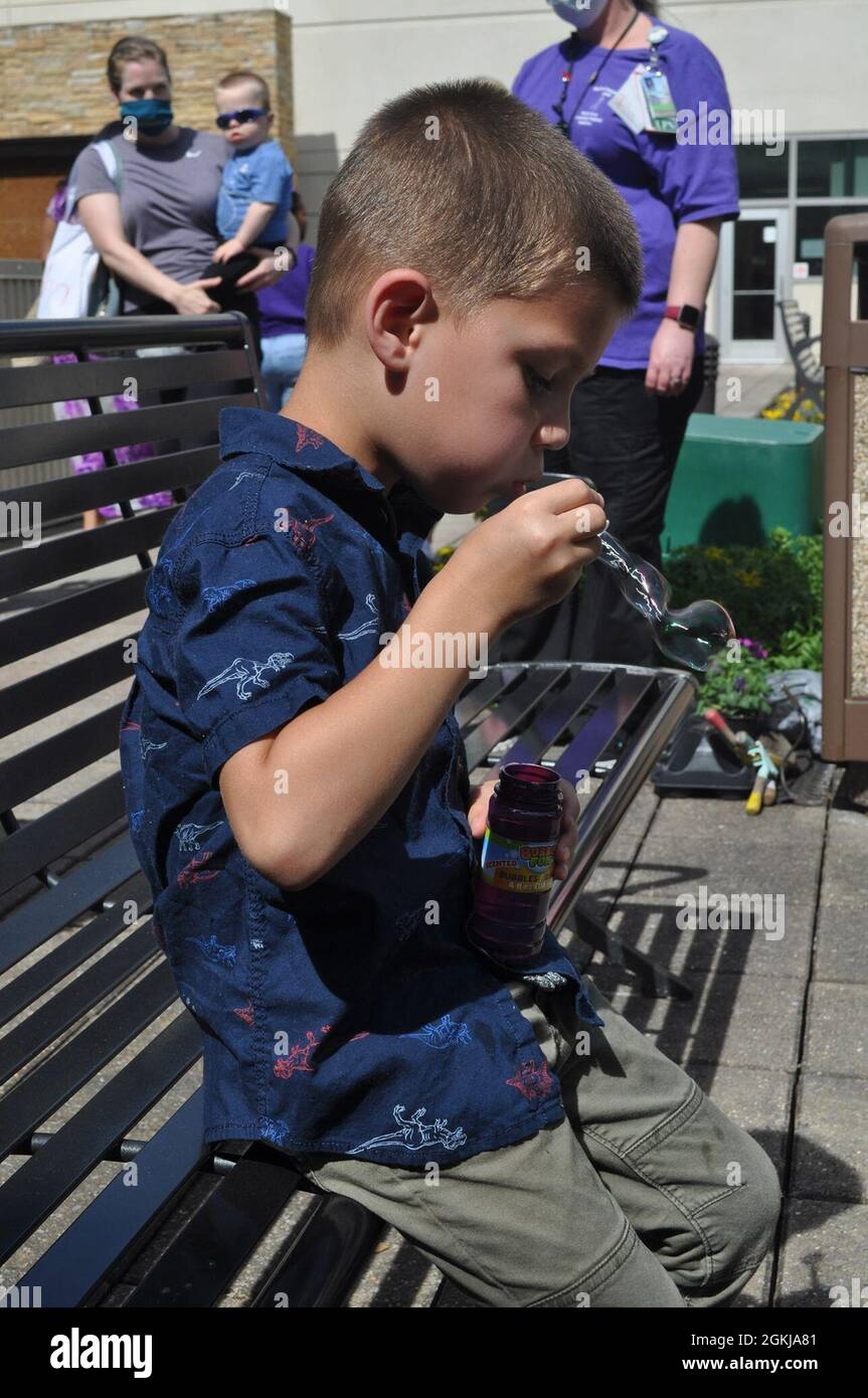 Five-year-old Cameron McDaniel blows bubbles as part of Martin Army ...