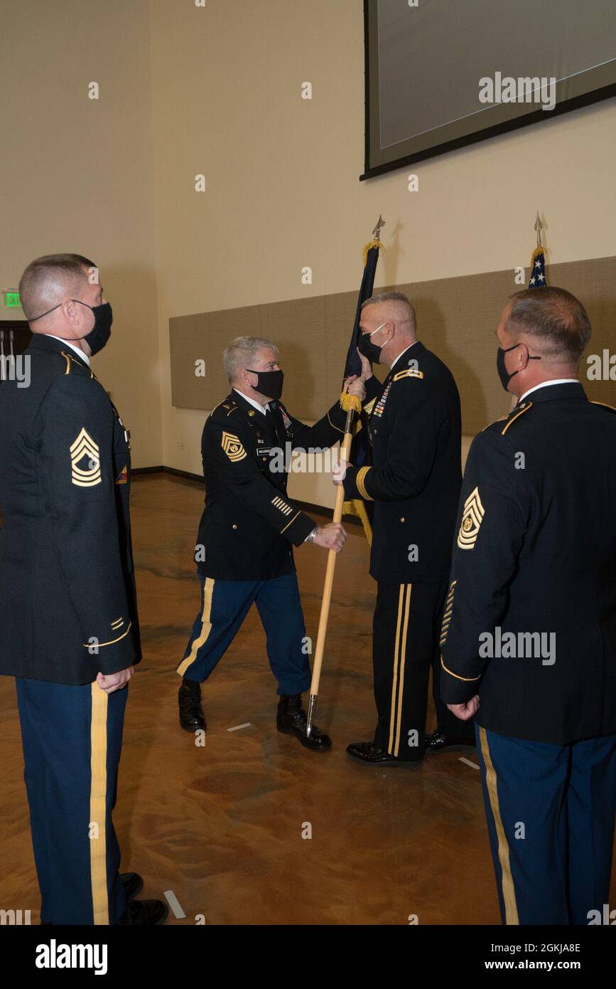 Command Sgt. Maj. Steven B. Wooldridge passes the organizational colors ...